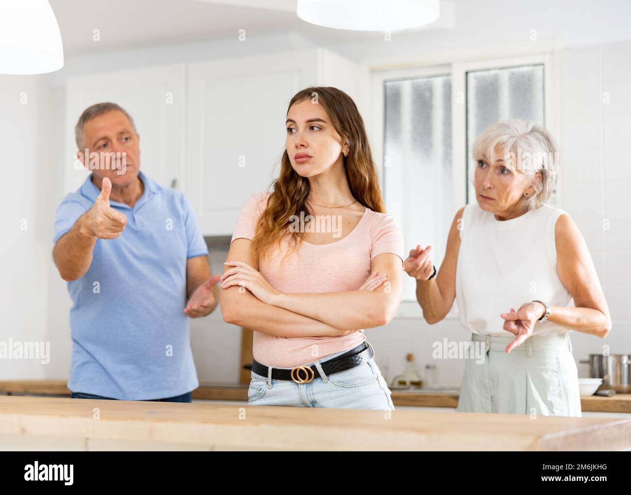 Parents lecturing their daughter Stock Photo - Alamy