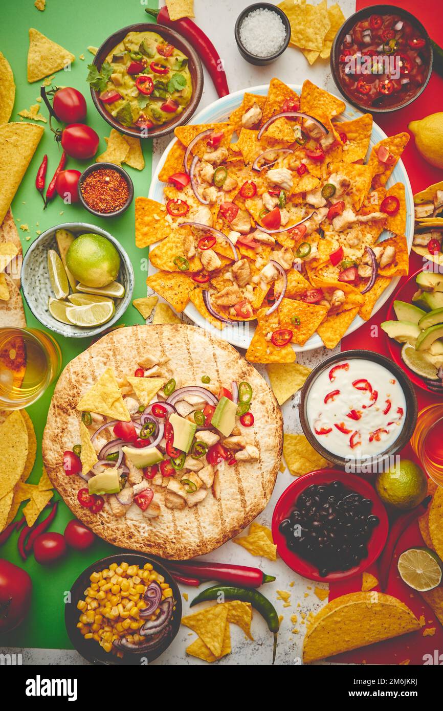 An overhead photo of an assortment of many different Mexican foods on a ...