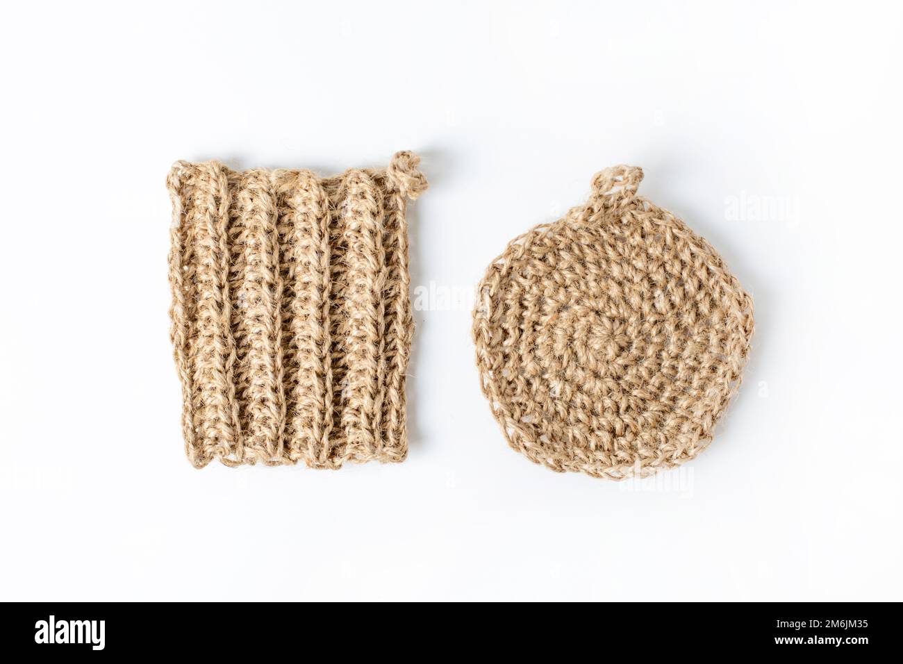 Natural washcloth made of craft thread for washing dishes. The concept ...