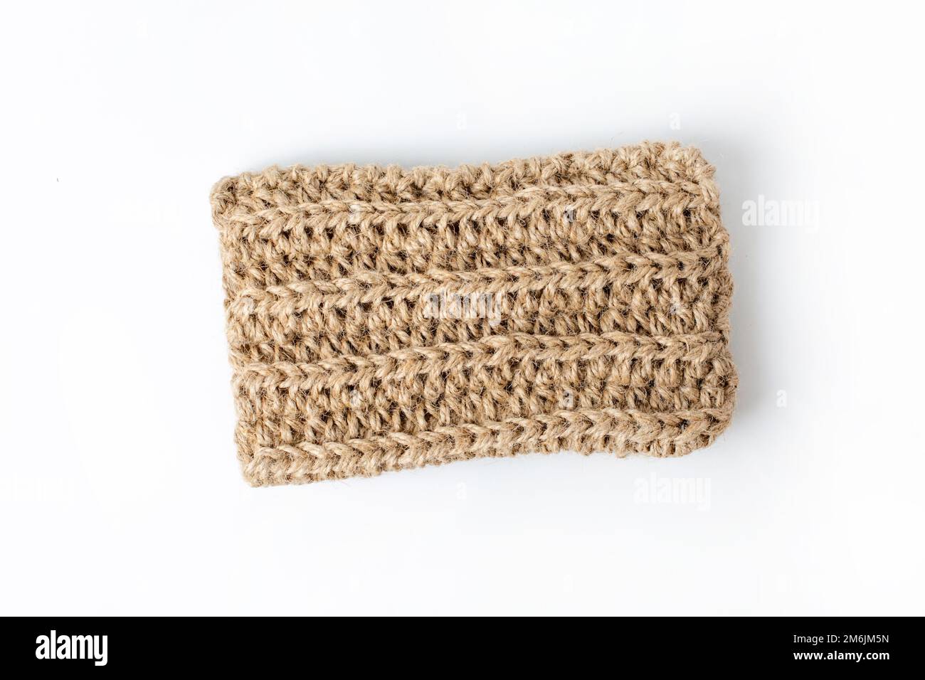 Natural washcloth made of craft thread for washing dishes. The concept ...