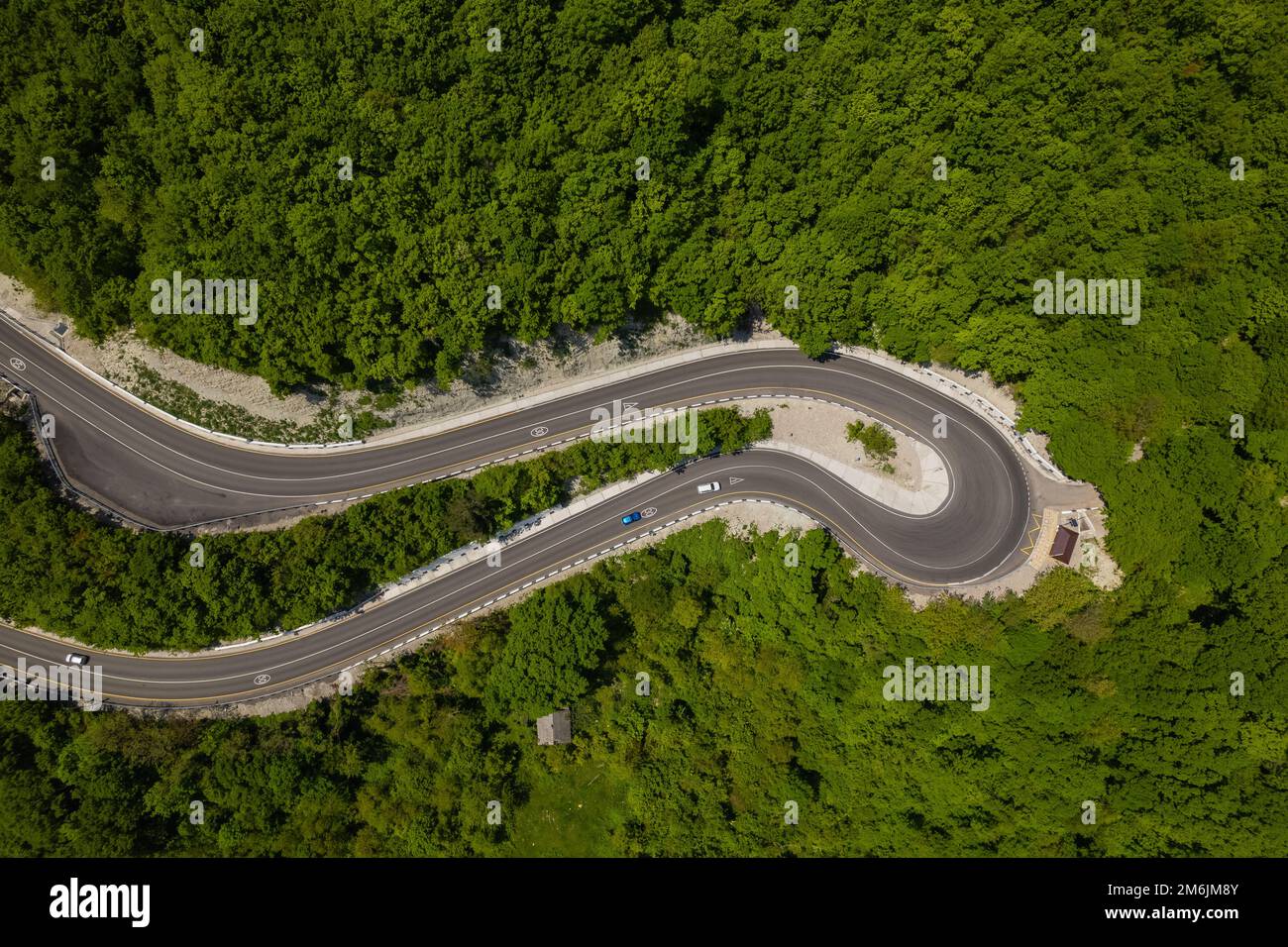 Aerial view of winding road from the high mountain pass. Great road ...