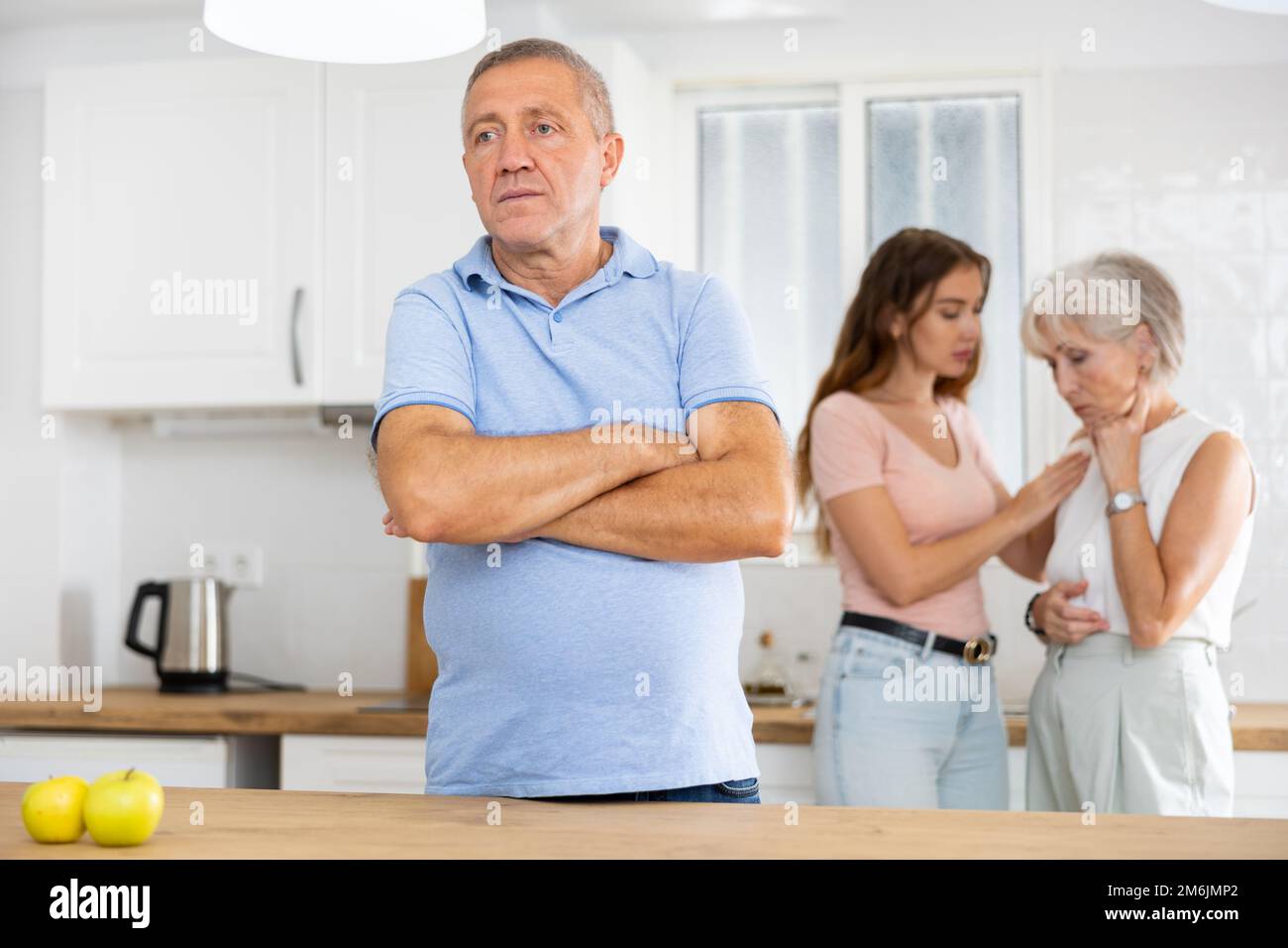 Portrait of unhappy father not taking after quarrel, standing in the ...