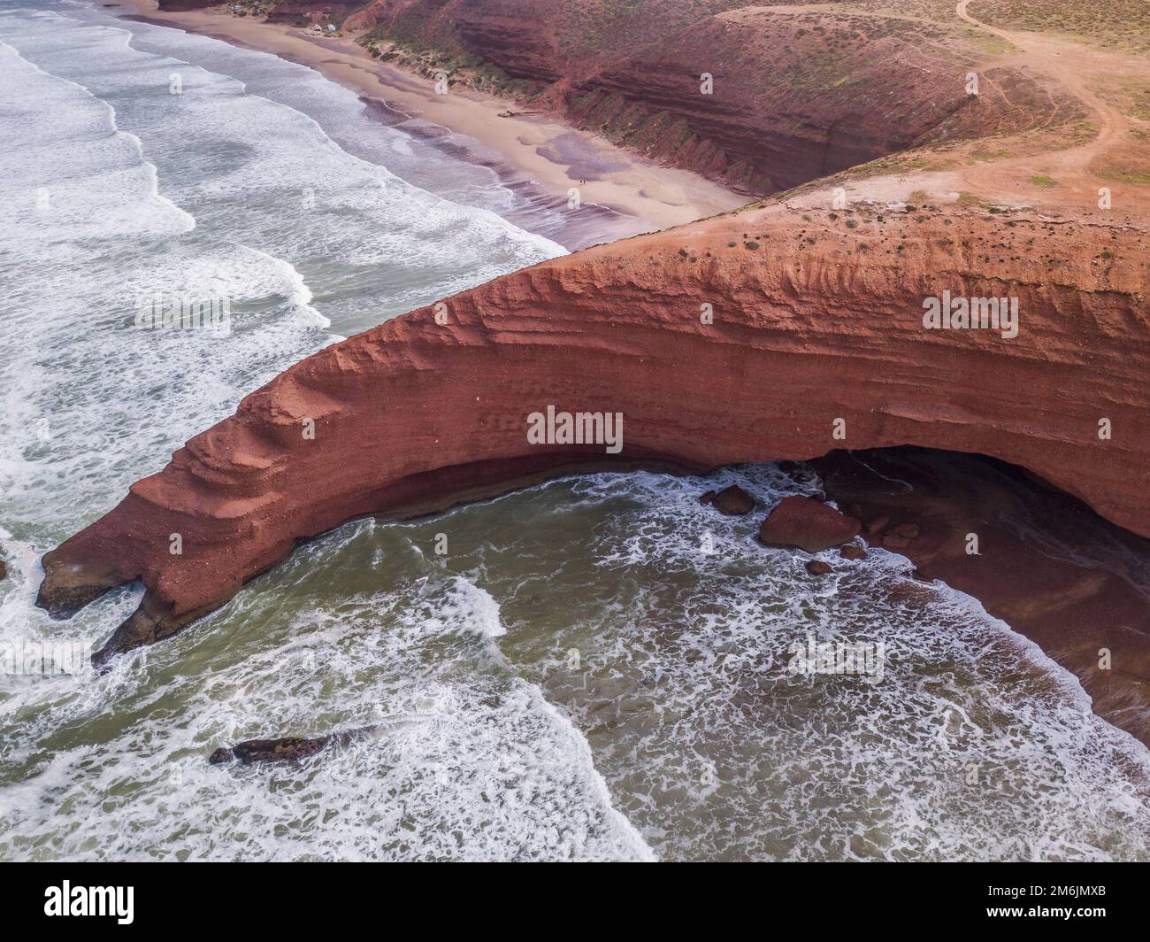 Arched rock on Legzira beach in Morocco Stock Photo - Alamy