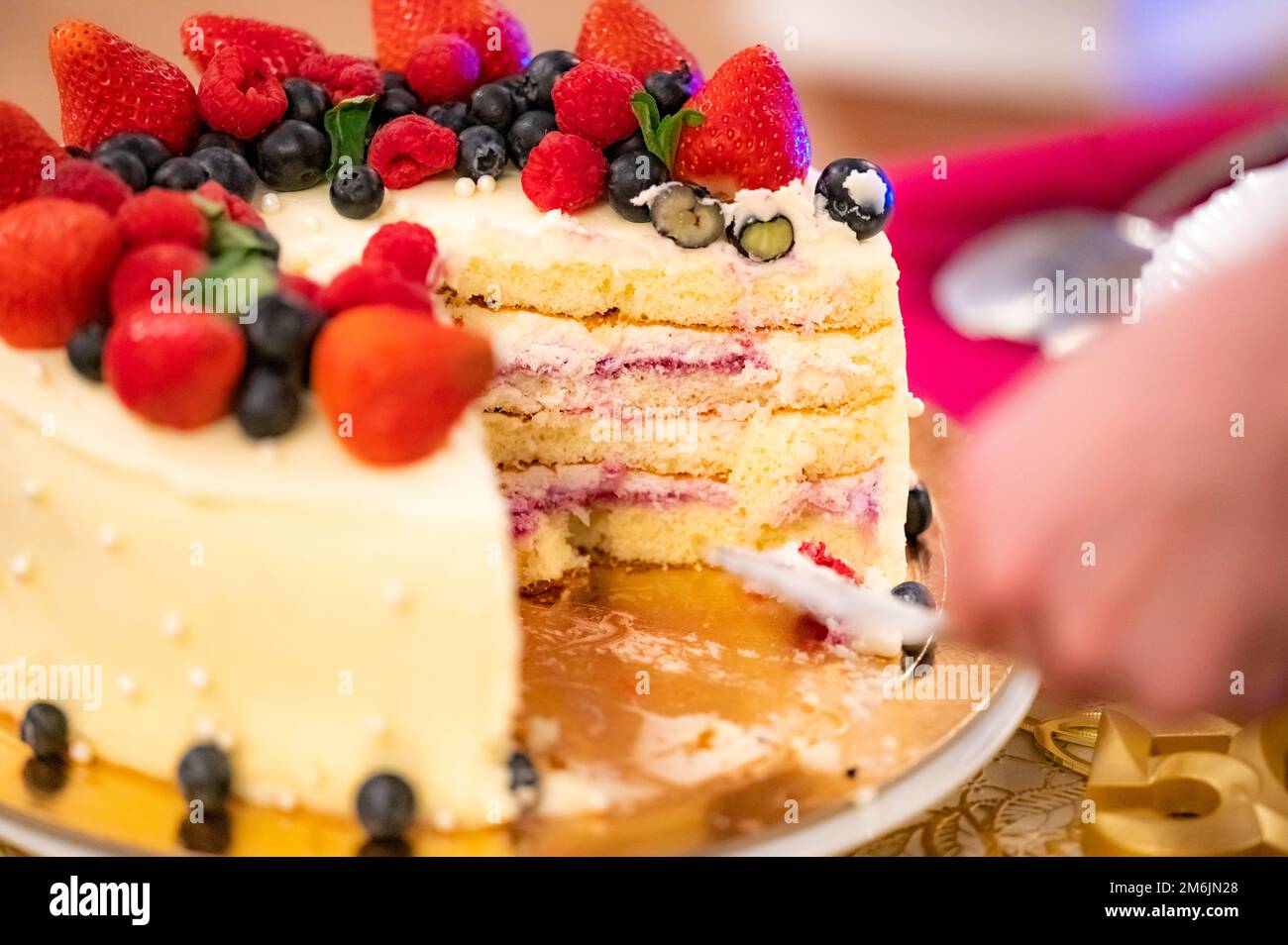 Person cutting birthday cake hi-res stock photography and images - Alamy