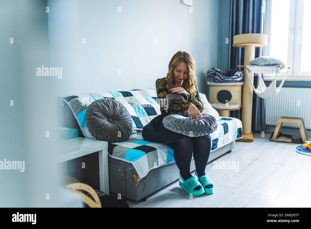 Cat in bed with woman hi-res stock photography and images - Alamy