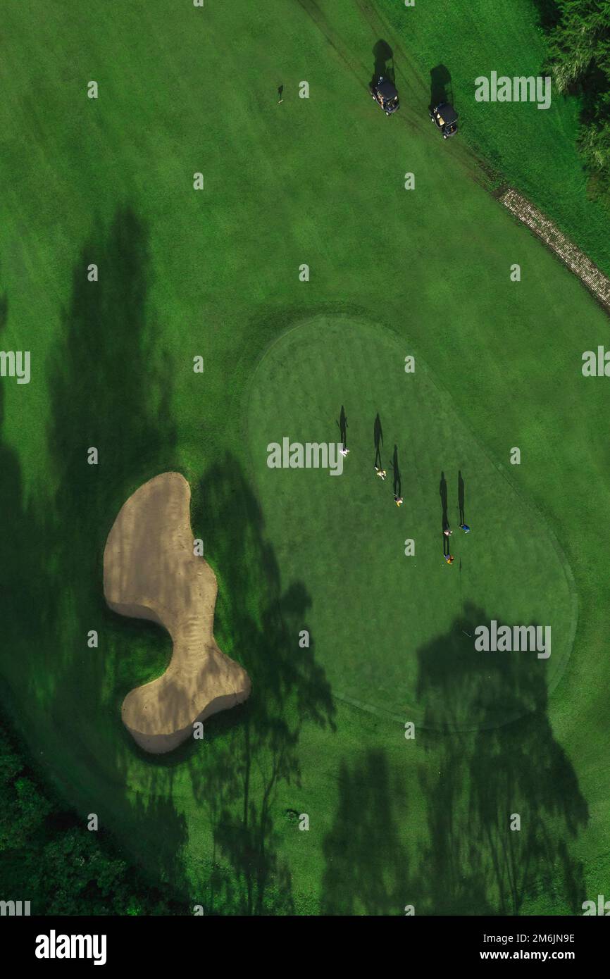 Aerial view of players at golf field Stock Photo - Alamy