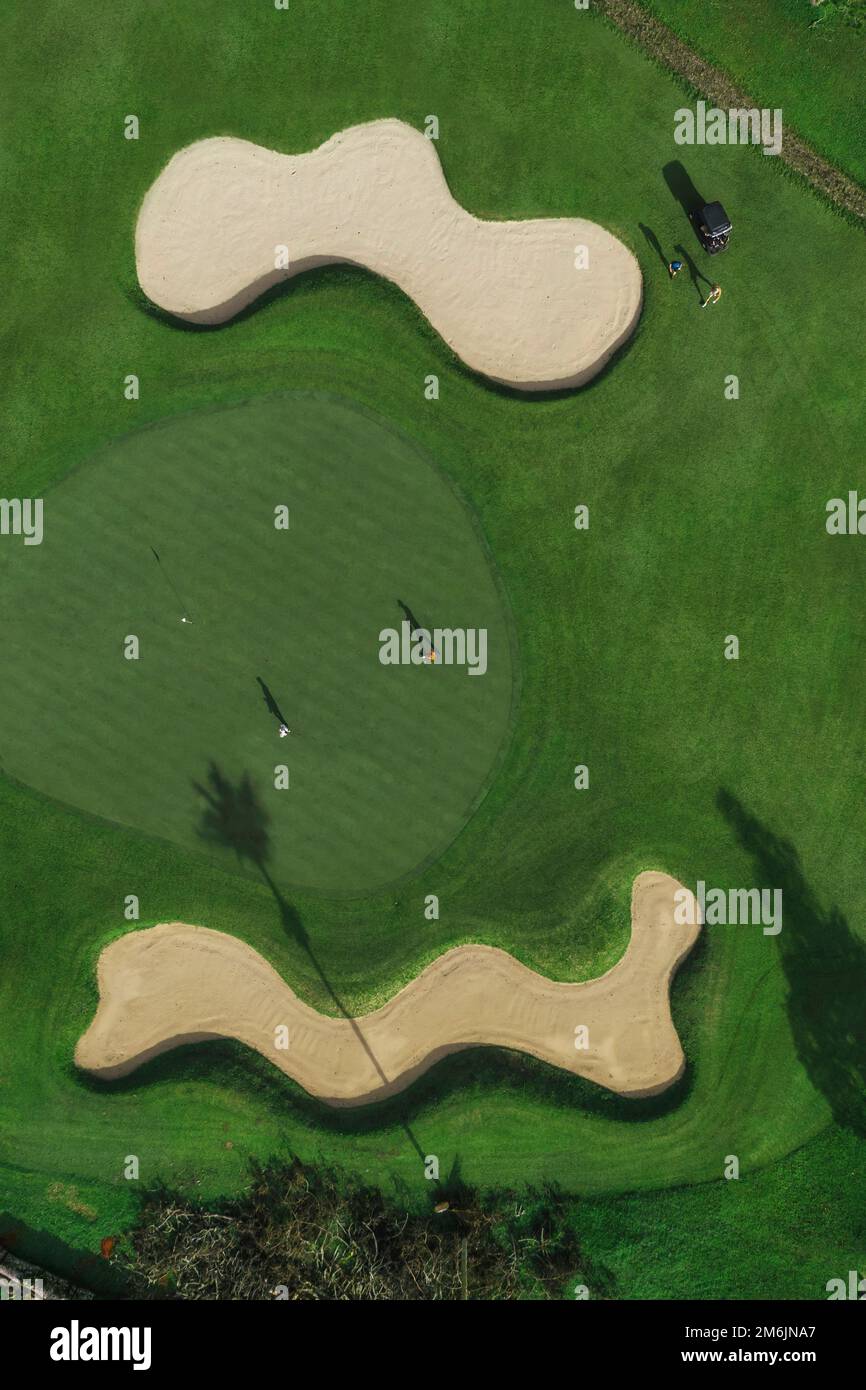 Aerial view of players at golf field Stock Photo - Alamy