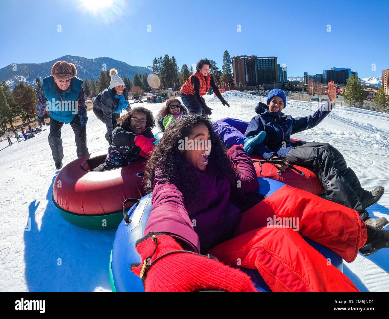 A family takes a selfie as they snow tube in Stateline, Nevada Stock ...