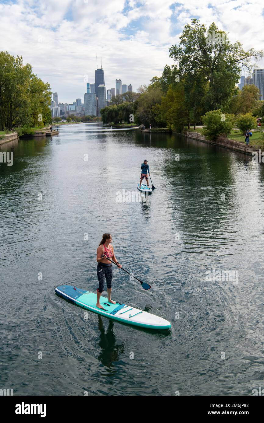 High angle view of male and female friend paddleboarding in river Stock ...
