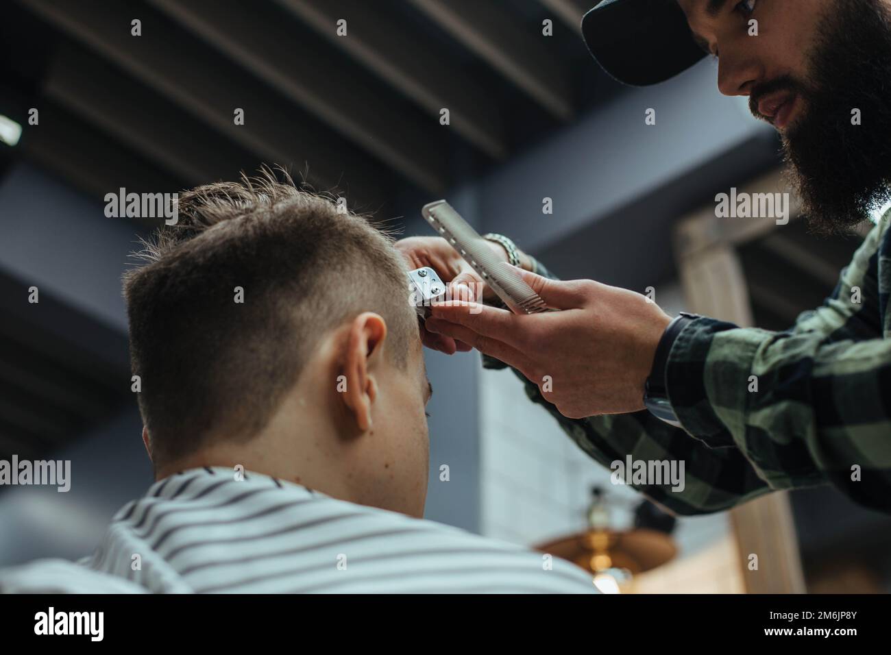 Stylish man sitting barber shop hi-res stock photography and images - Alamy