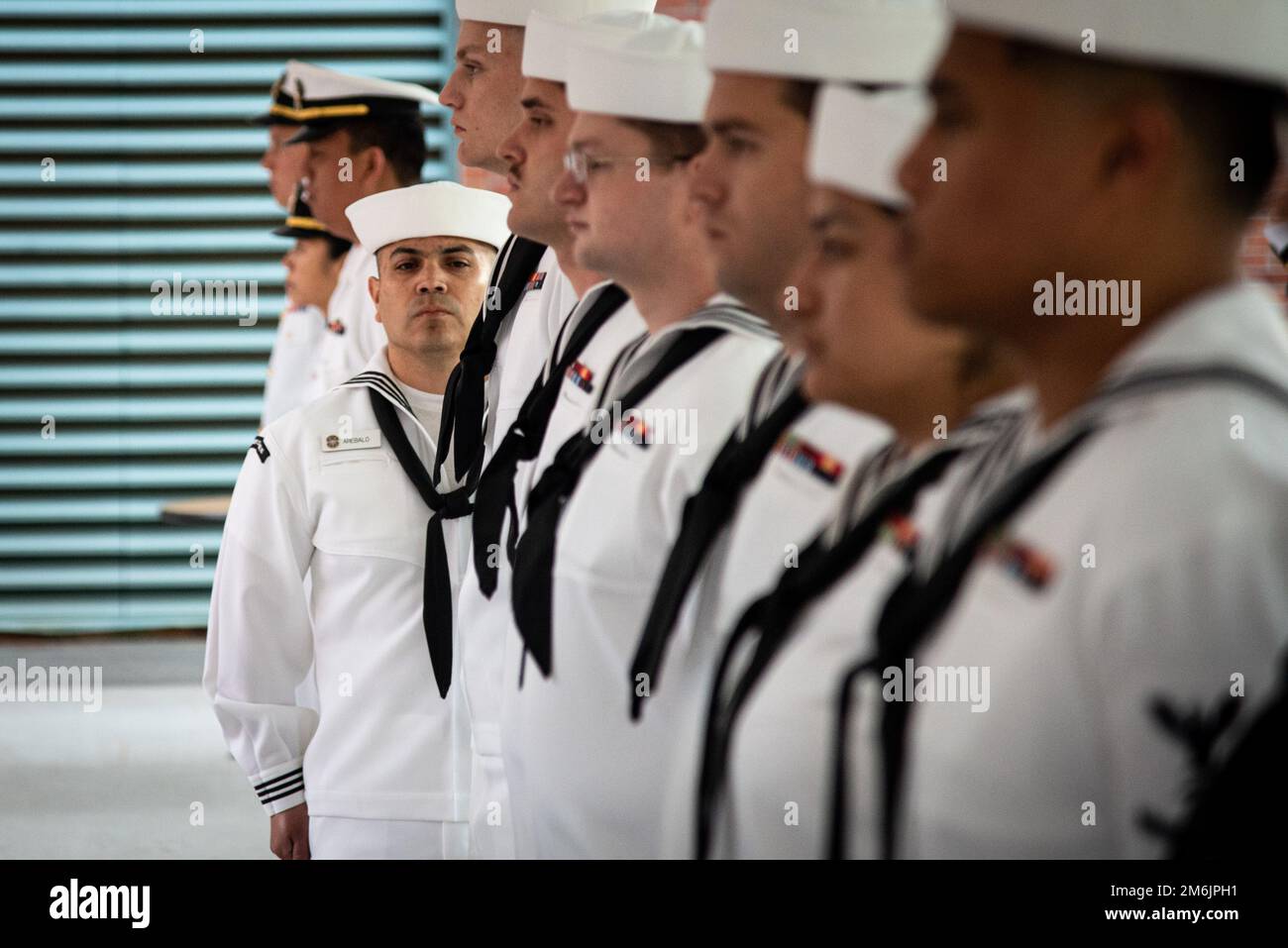 Hospital Corpsman First Class Michael Arebalo, center, inspects the ...