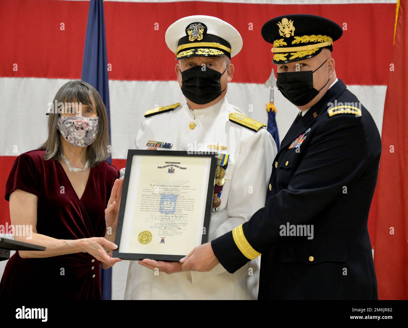 New York Rear Admiral Lawrence Weill, center, displays his commission ...