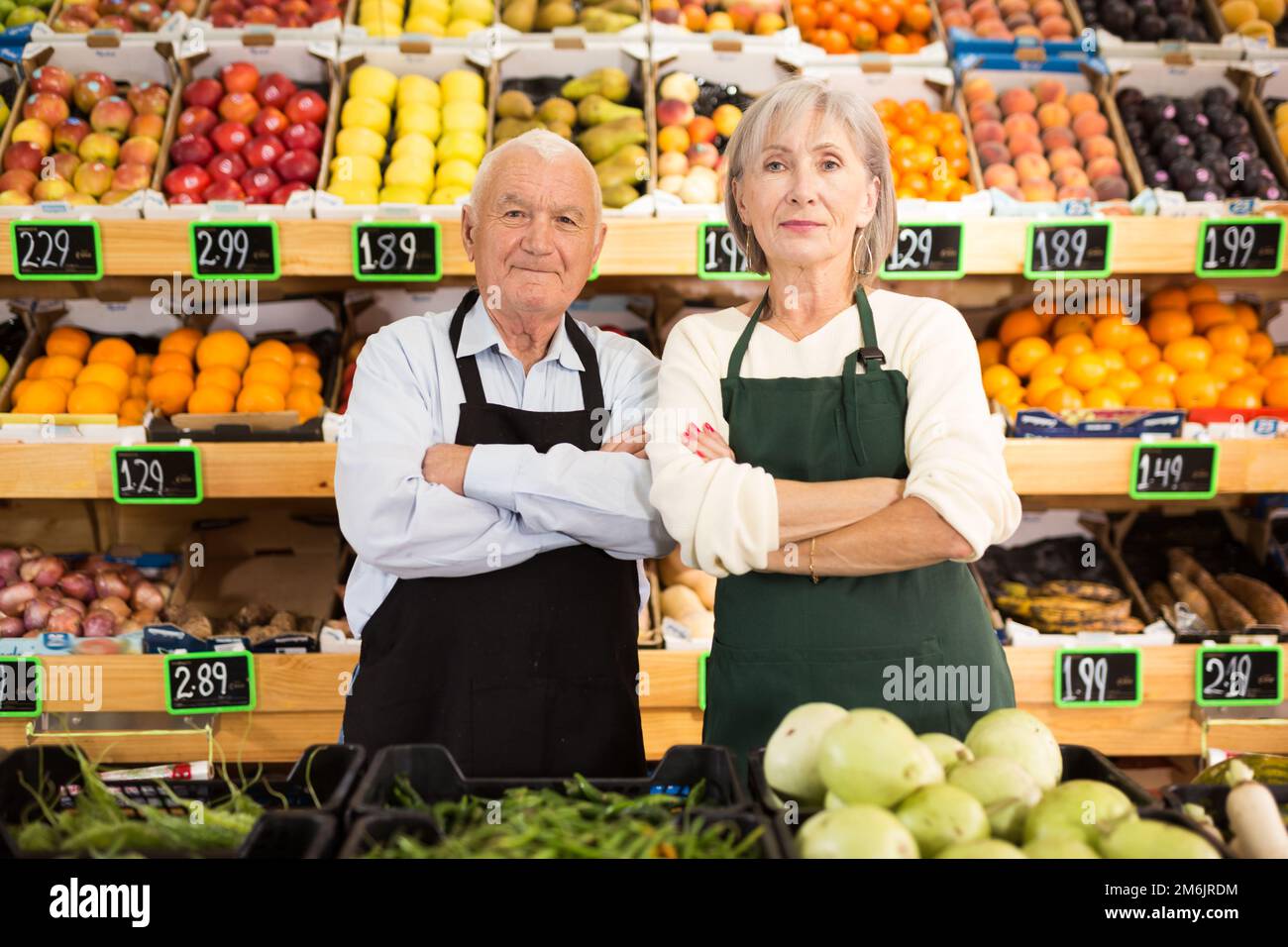 Portrait of two successful supermarket workers in trading floor Stock ...