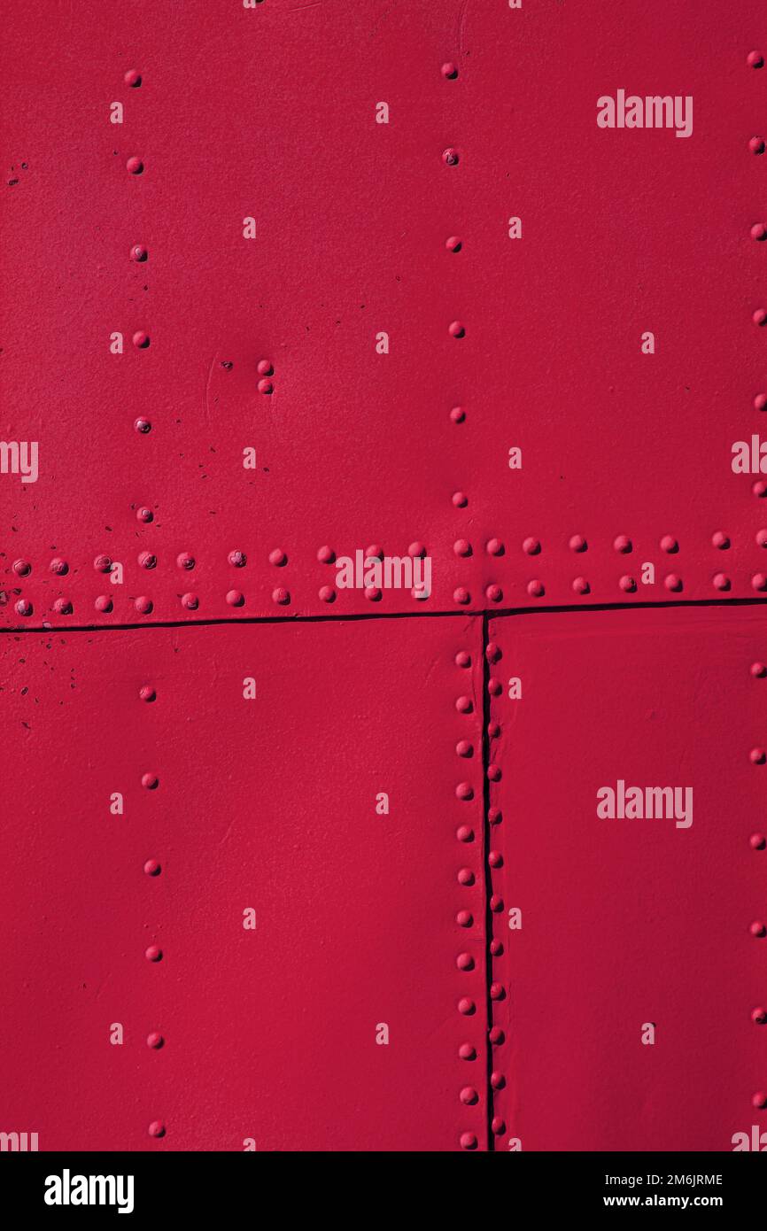 A metal surface made of several sheets connected with rivets. Viva ...