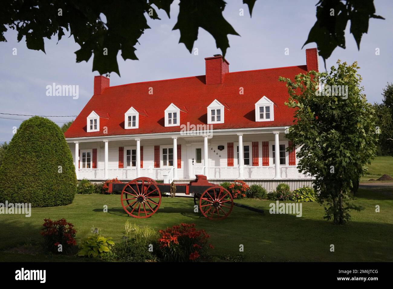 Red house two white windows hi-res stock photography and images - Alamy