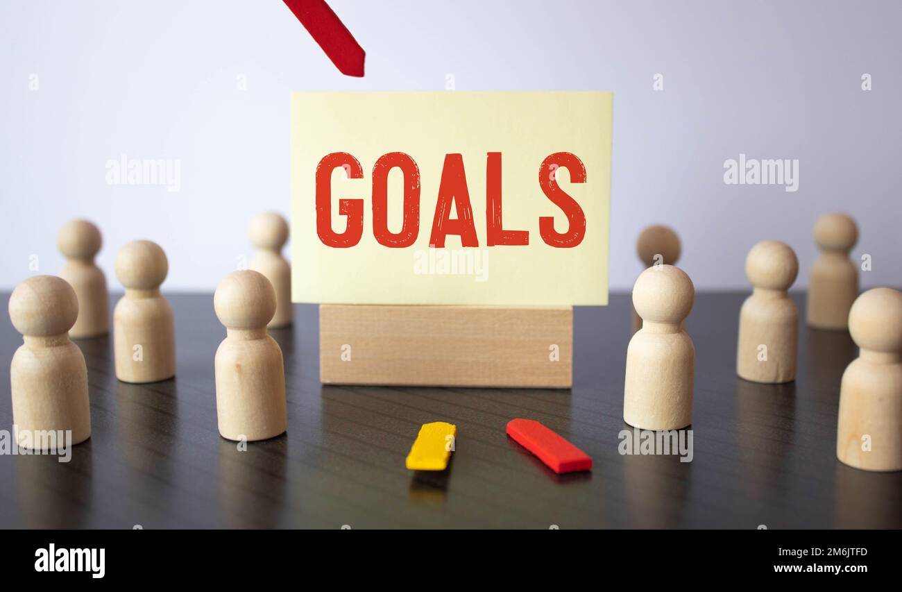 White chalk hand writing in word goal and circle shape on blackboard ...