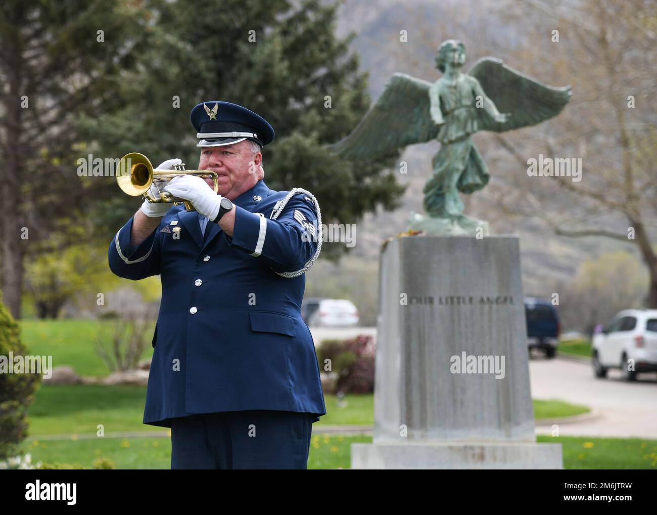 A trumpeter from the Combined Veterans Honor Guard plays “Taps” during ...
