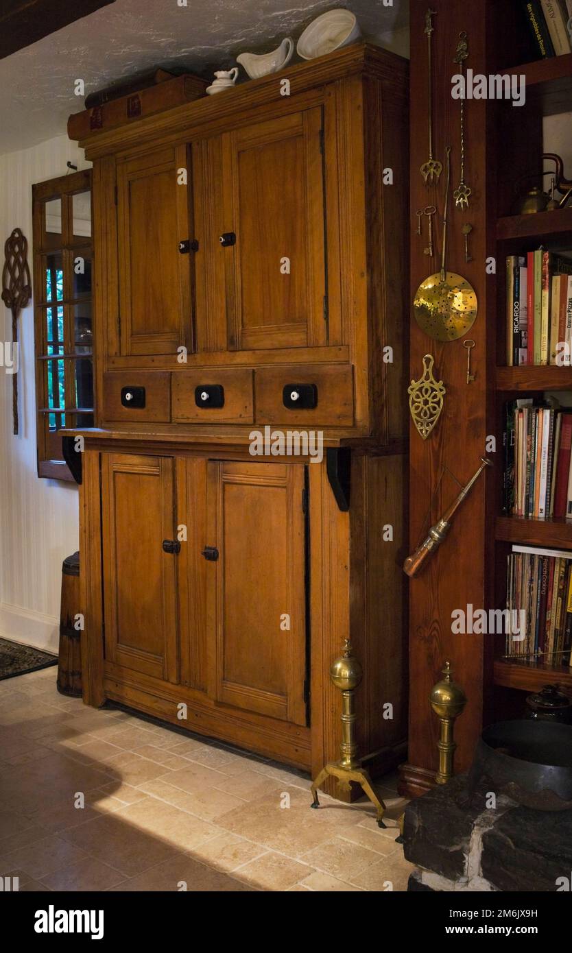 Handmade brown stained antique wooden buffet in kitchen inside old 1809 ...