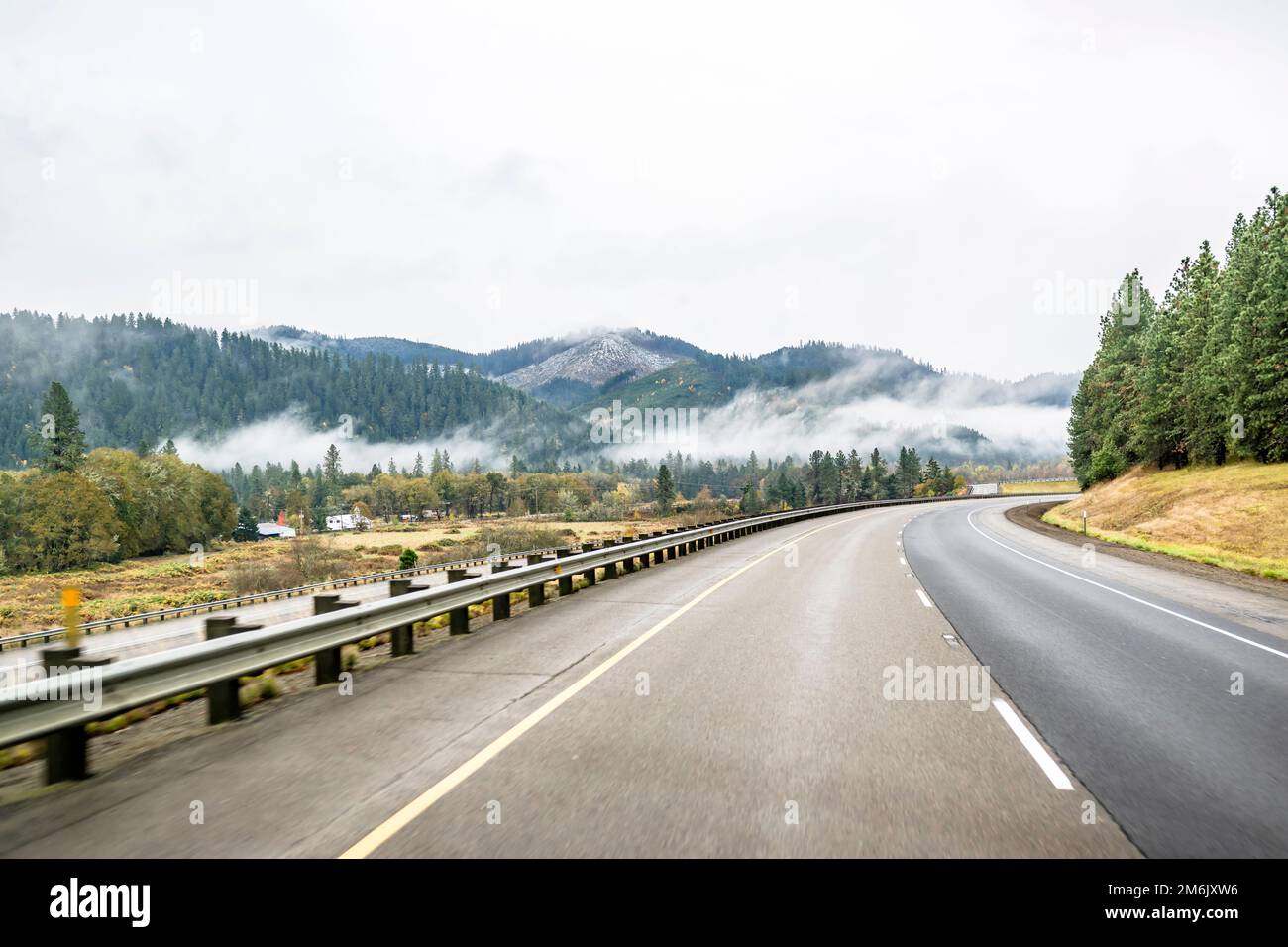 Scenic autumn landscape with a winding mountain highway road with ...