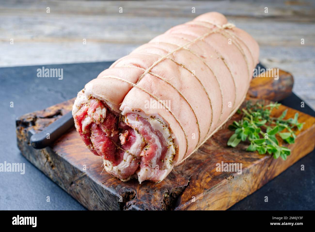 Traditional raw Filipino lechon kawali pork belly roll meat as piece ...