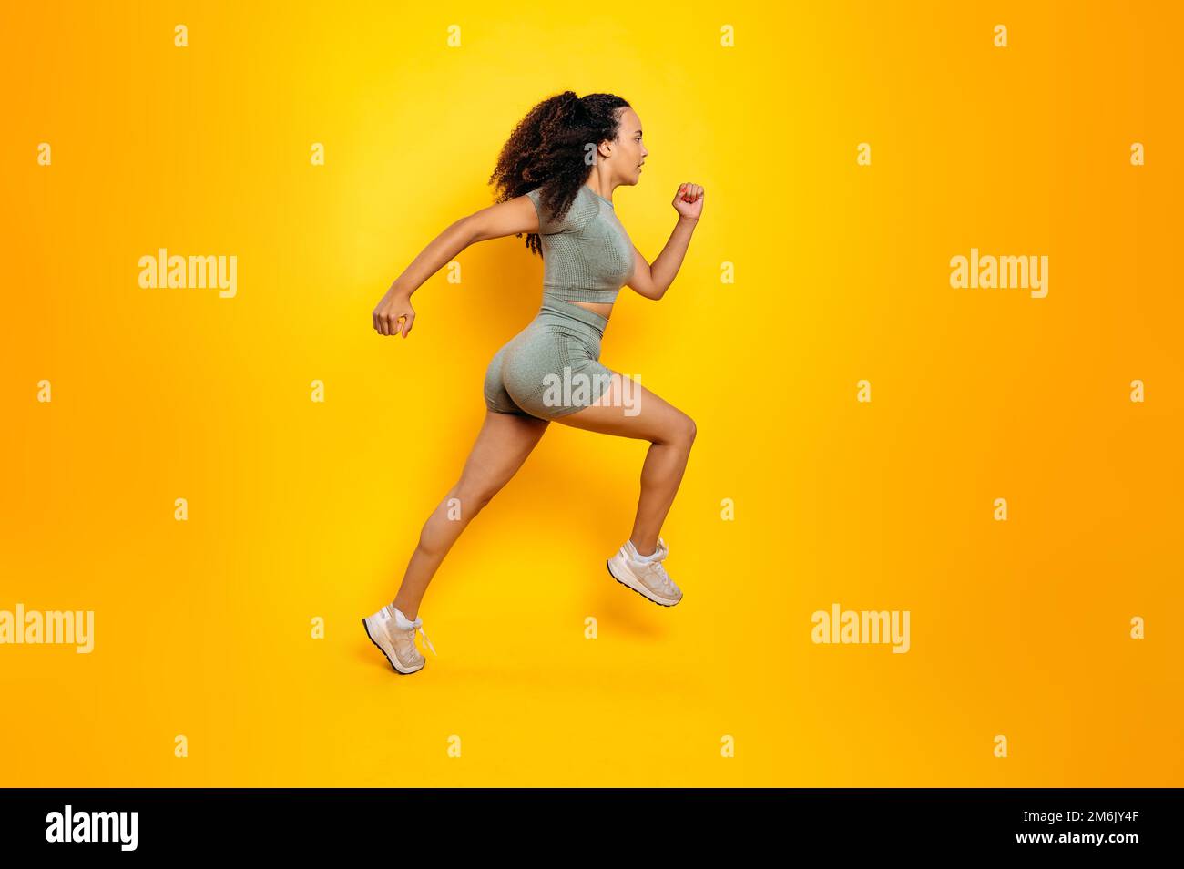 Female jogger jumping hi-res stock photography and images - Alamy