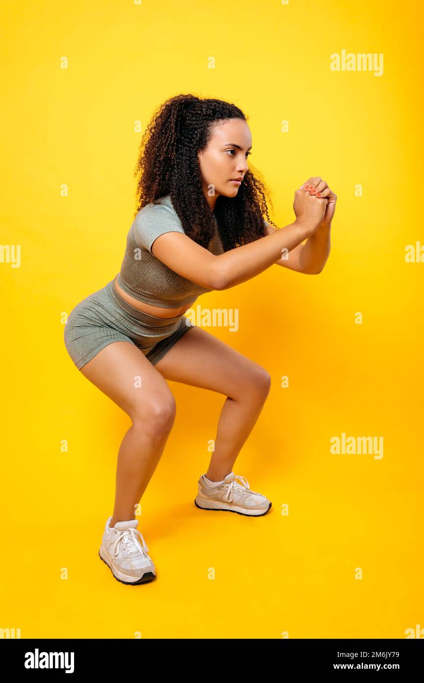 Sports lifestyle. Full length vertical photo of a fitness sporty lovely ...