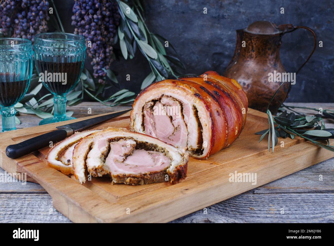 Traditional barbecue Italian porchetta pork belly roll meat as piece ...