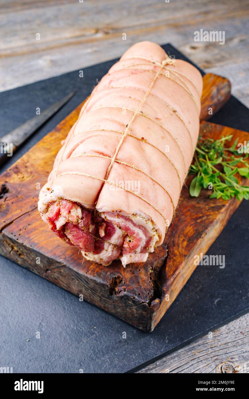 Traditional raw Filipino lechon kawali pork belly roll meat as piece ...