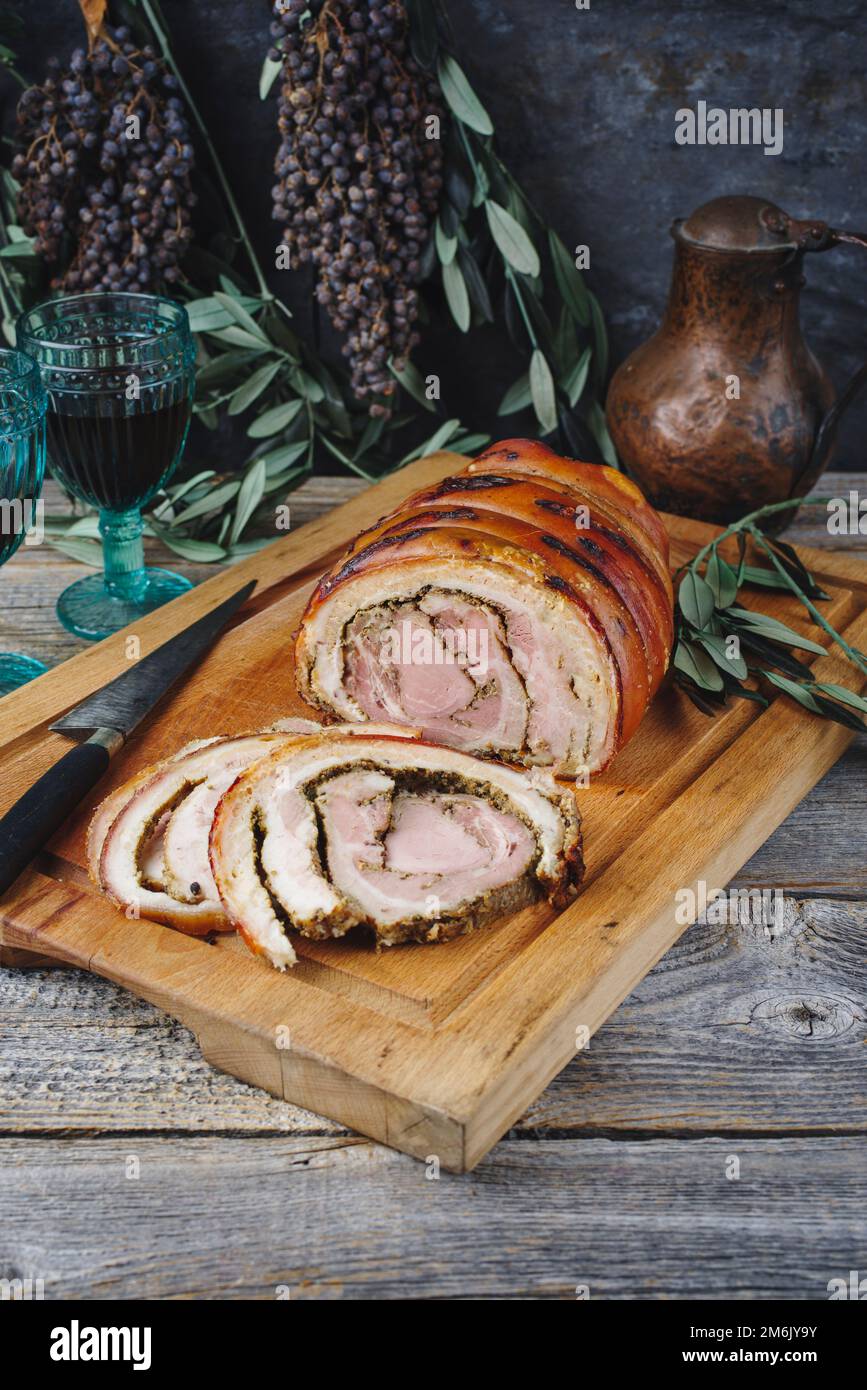 Traditional barbecue Italian porchetta pork belly roll meat as piece ...