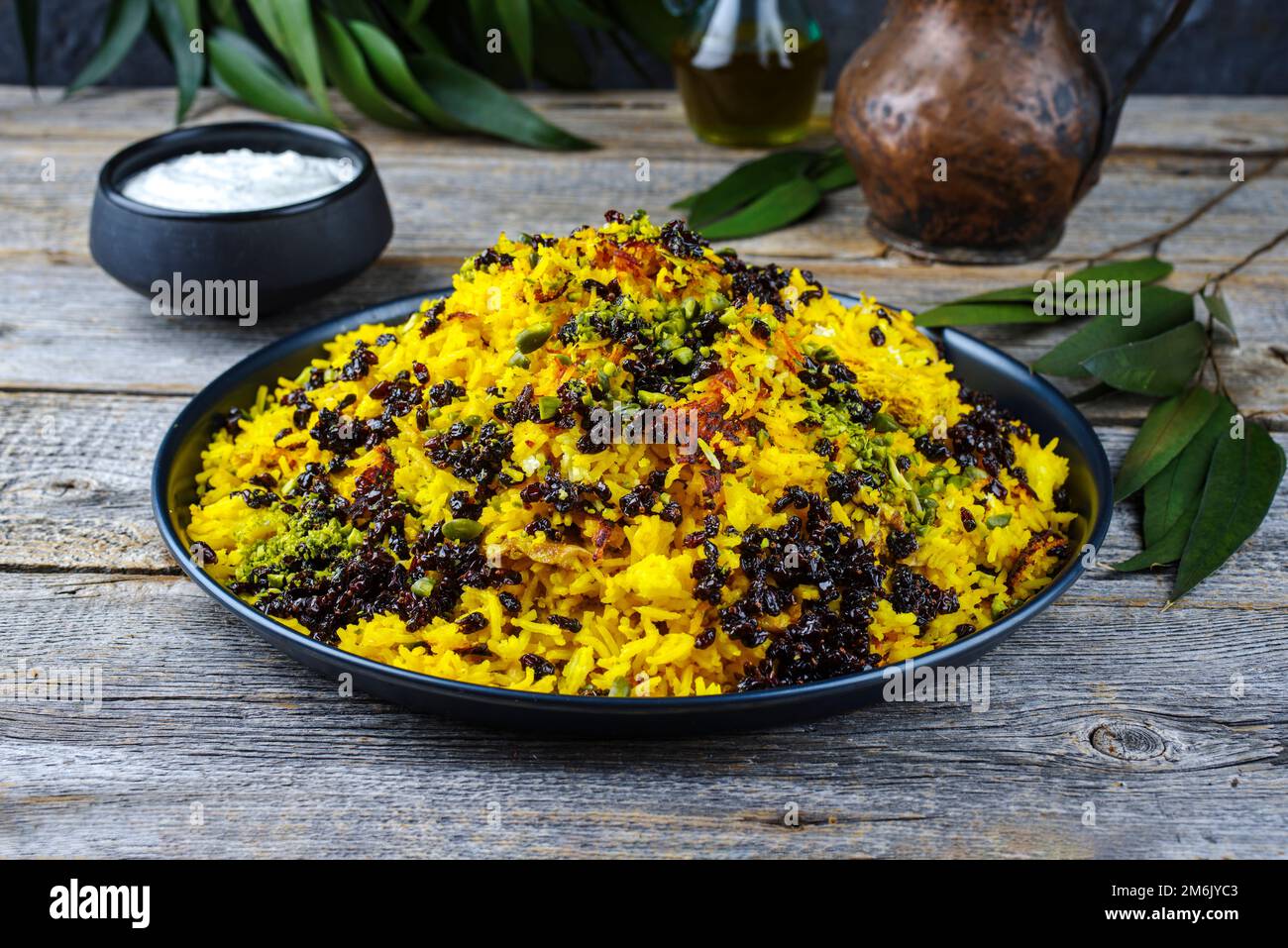 Traditional Persian zereshk polo with saffron rice and berberis served ...