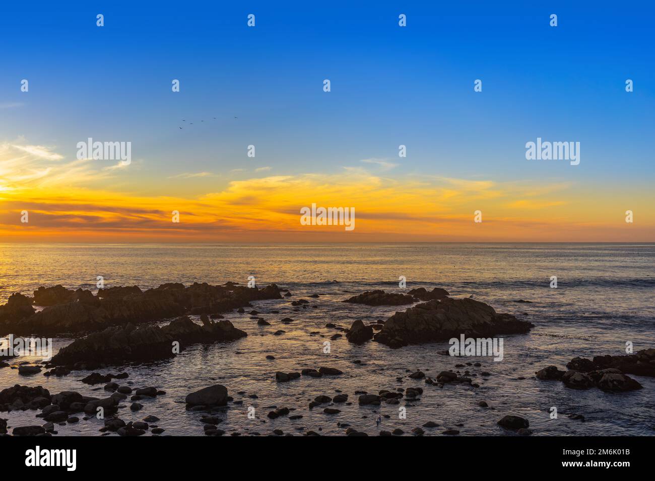 A wide view of a sunset of the Monterey Bay in California Stock Photo ...