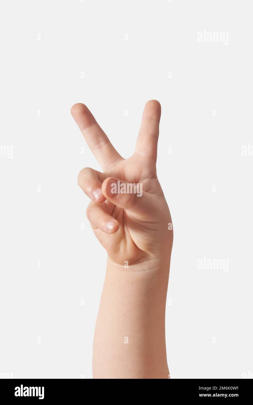 Child girl showing victory hand hi-res stock photography and images - Alamy