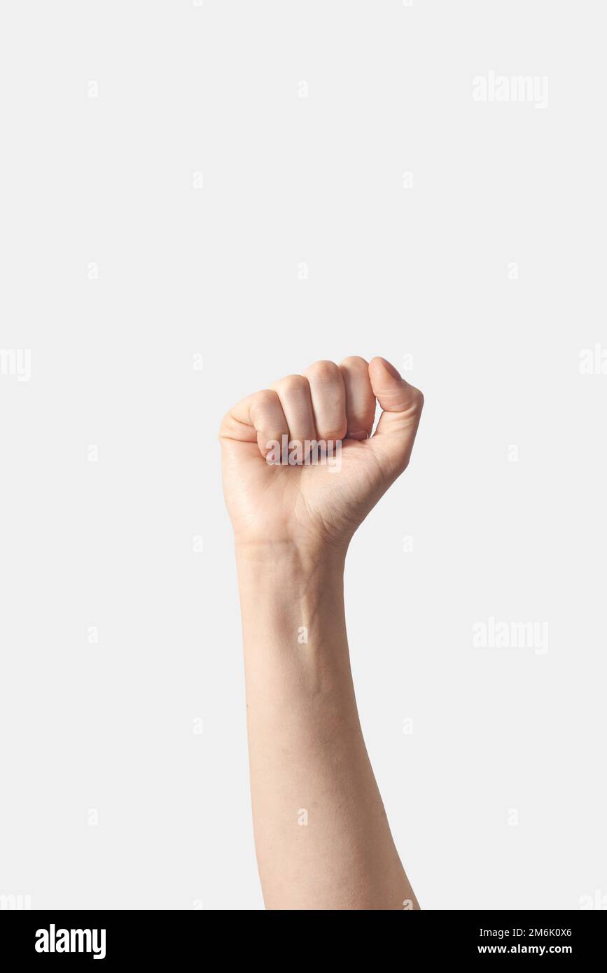 Fist up, victory symbol female hand Stock Photo - Alamy