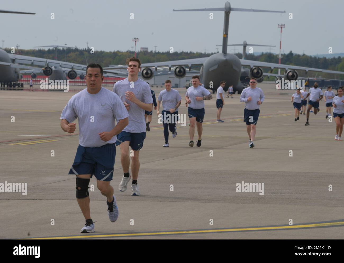 U.S. Air Force Airmen race to the finish line during a wing run at ...