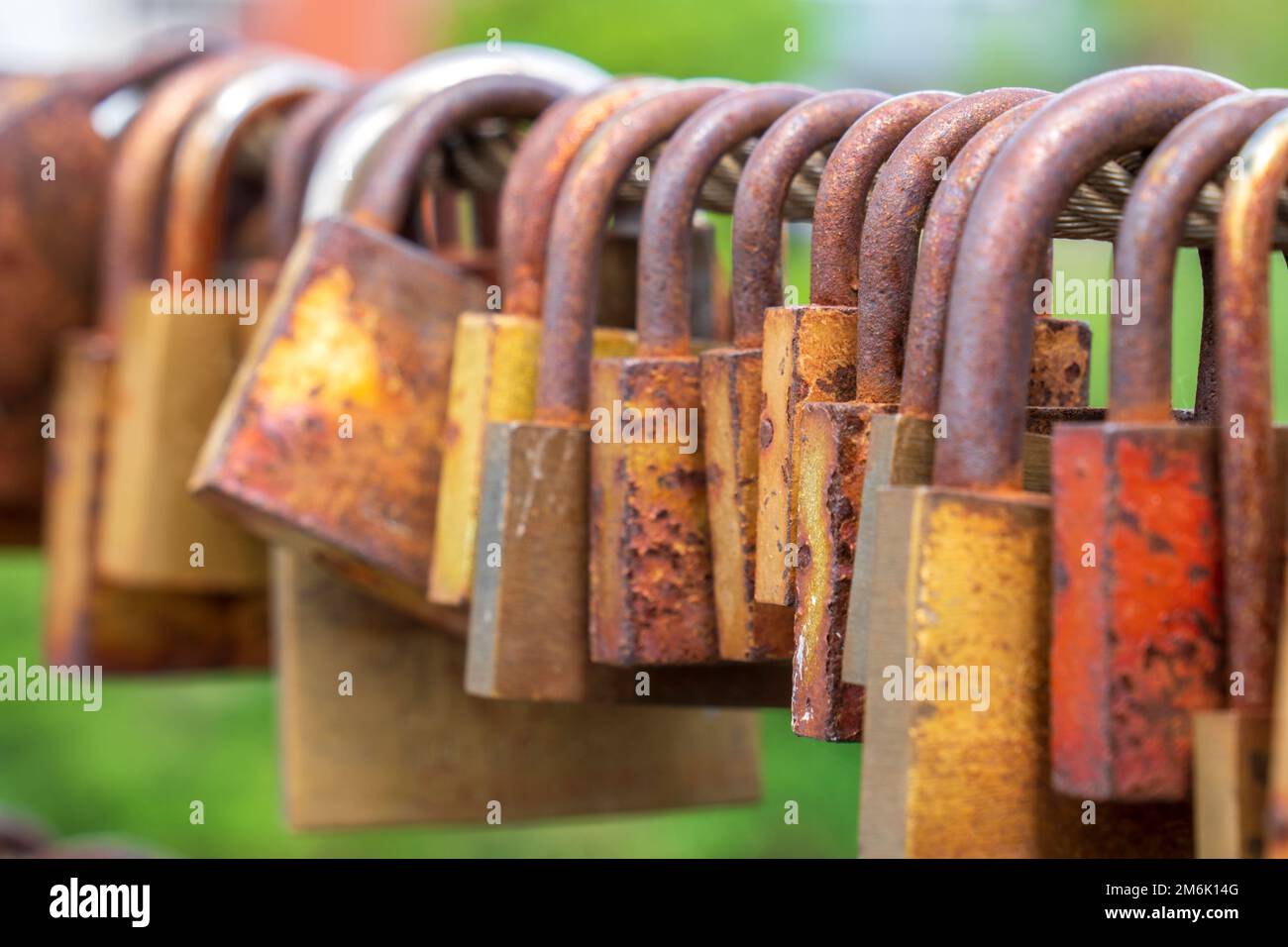 Love locks hang on the chain bridge in Bamberg Stock Photo - Alamy