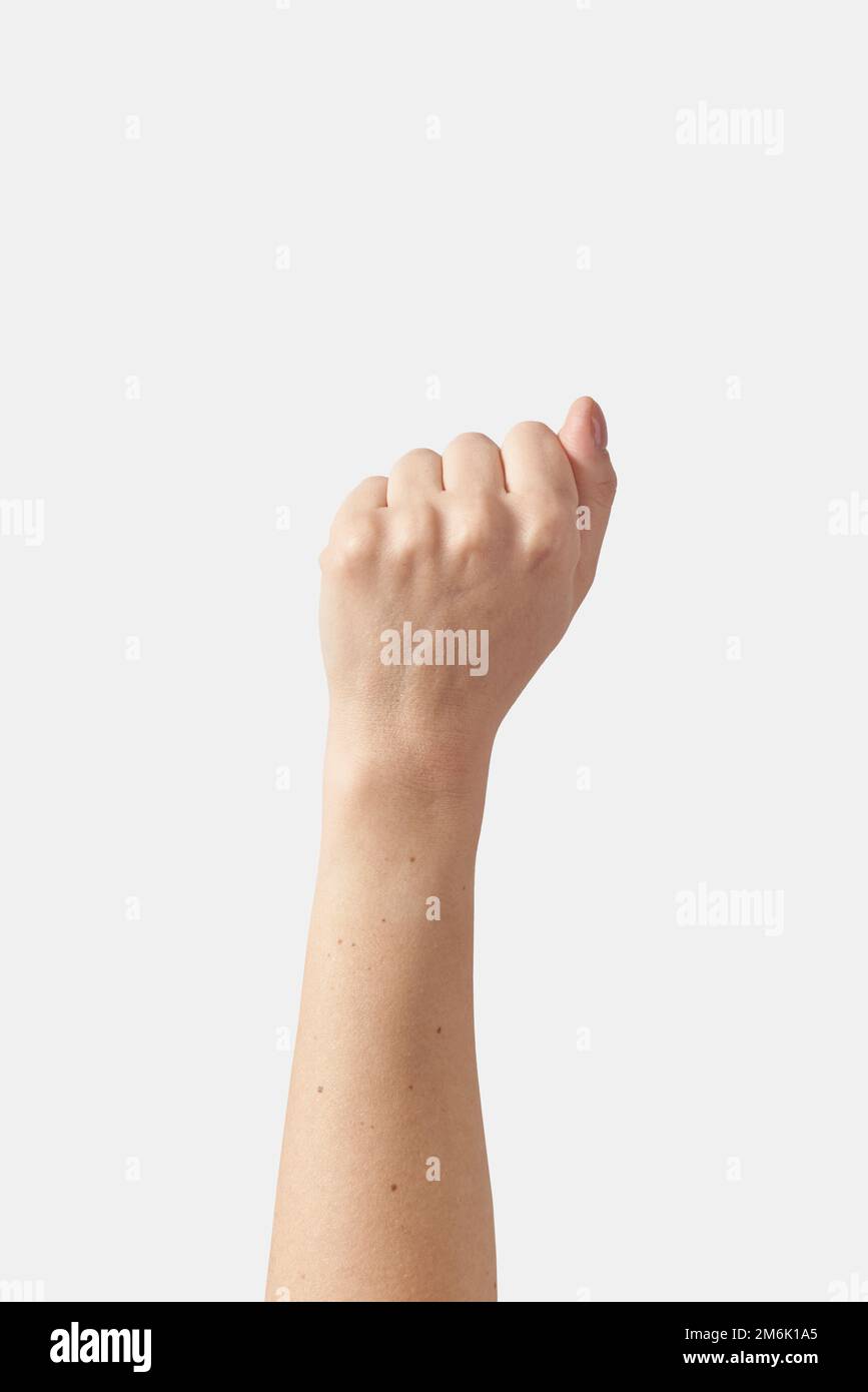 Fist up, victory symbol female hand Stock Photo - Alamy