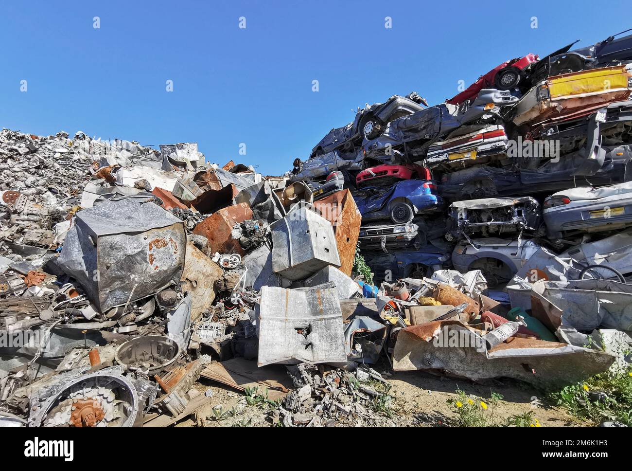 Pile of various scrap cars and other metals on a junk yard ready ...