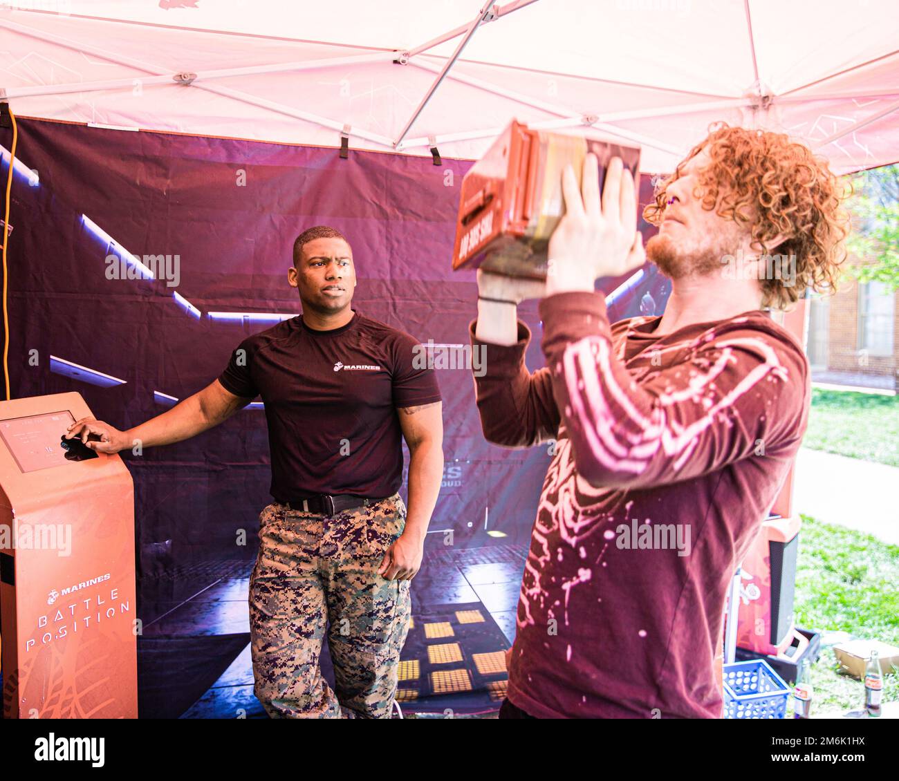 A Marine recruiter with Recruiting Station Frederick counts ammo can ...