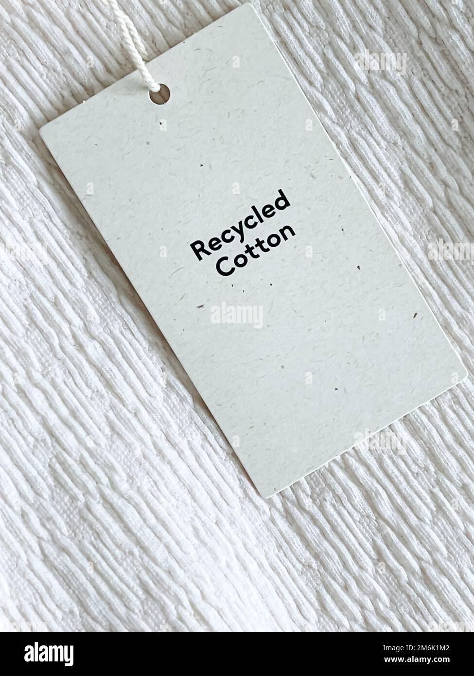 Recycled cotton fashion label tag, sale price card on luxury fabric ...