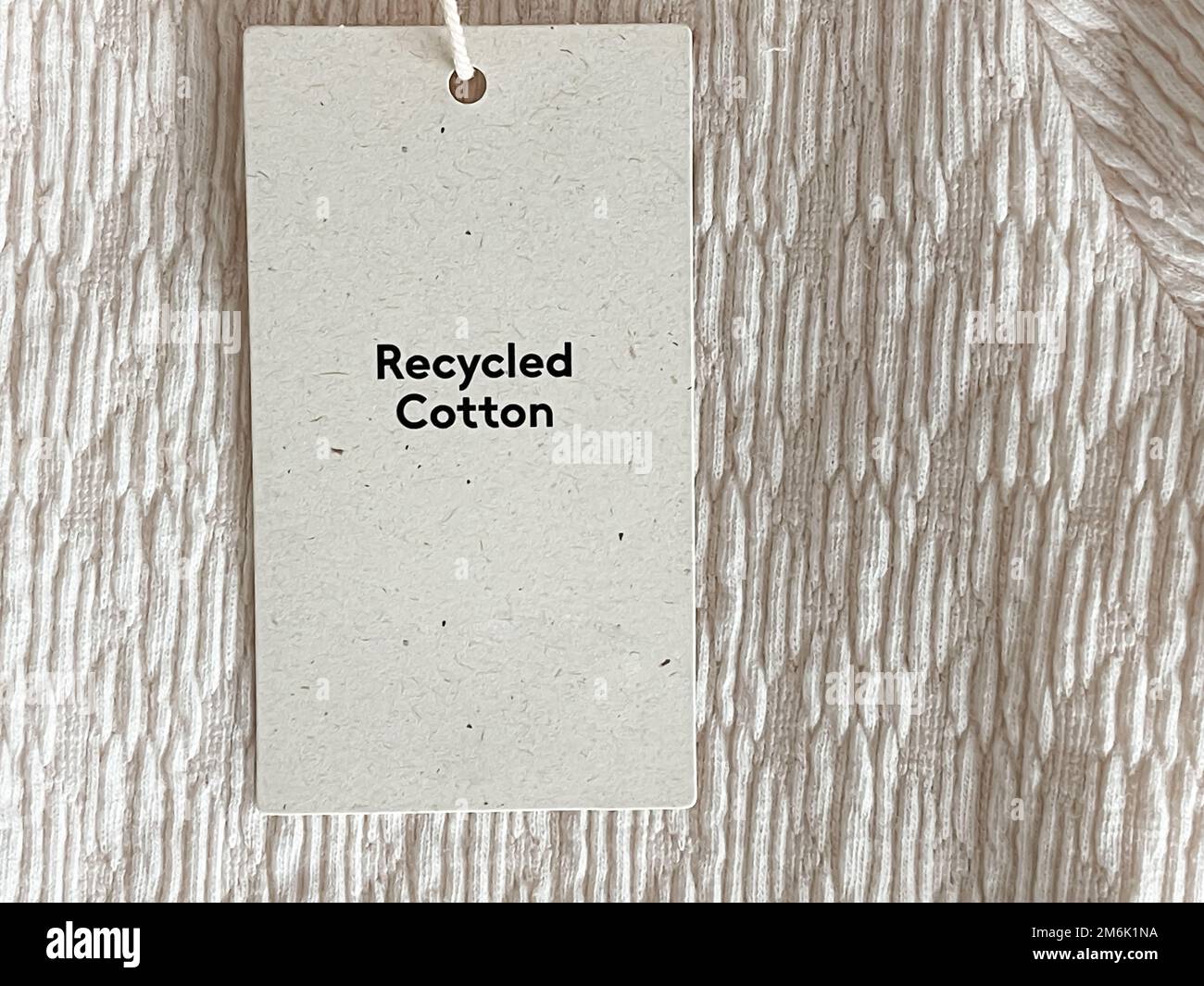 Recycled cotton fashion label tag, sale price card on luxury fabric ...