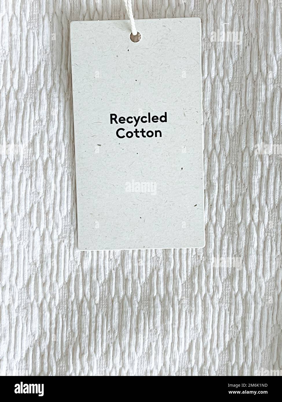 Recycled cotton fashion label tag, sale price card on luxury fabric ...
