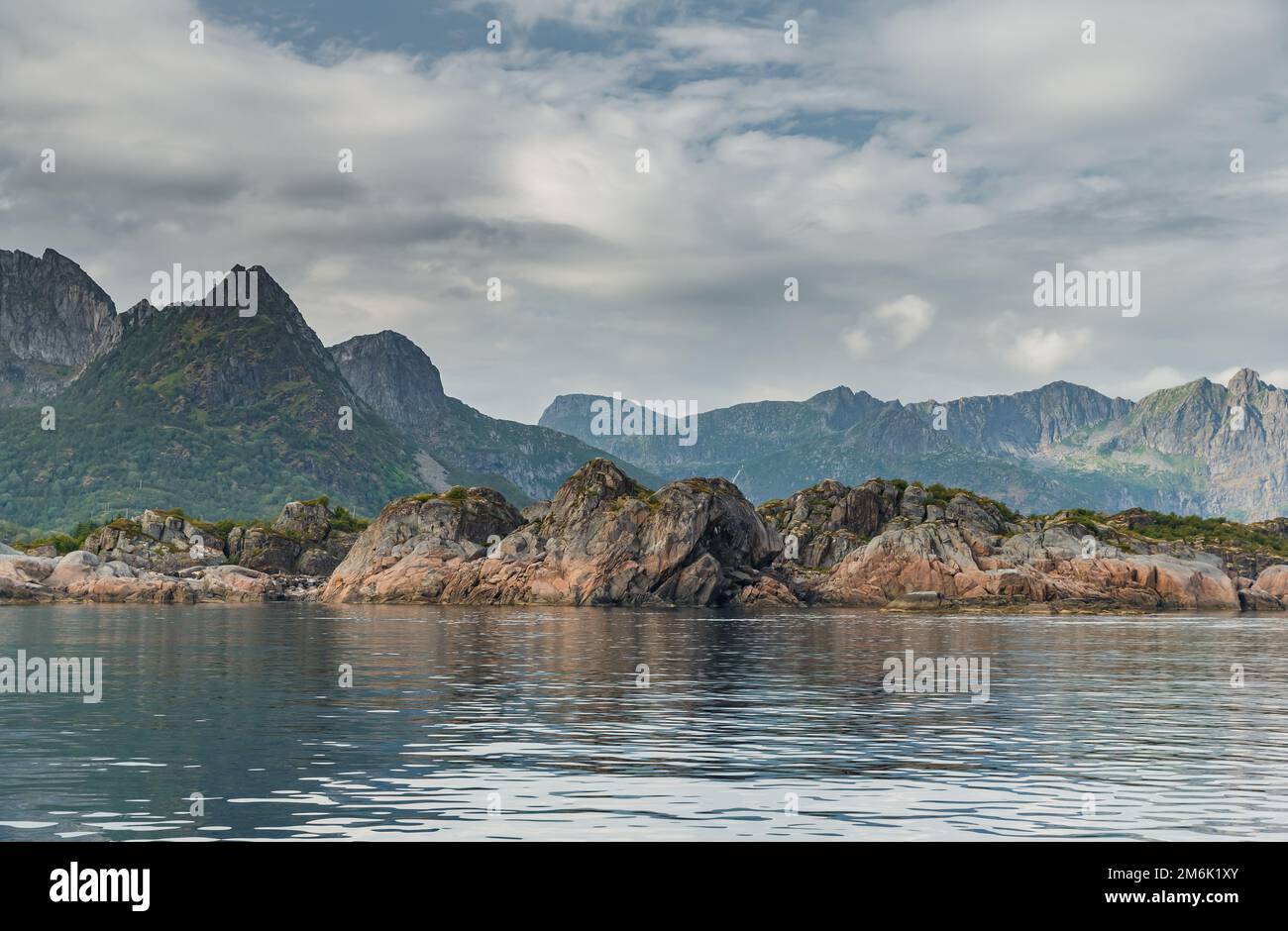 Norwegian seascape, rocky coast with dramatic skies, the sun breaks ...