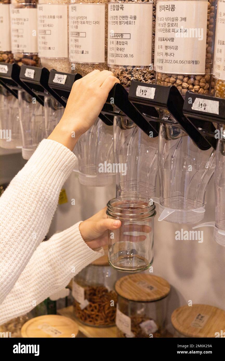 eco friendly habits hand gesture refill of mixed grain rice Stock Photo ...