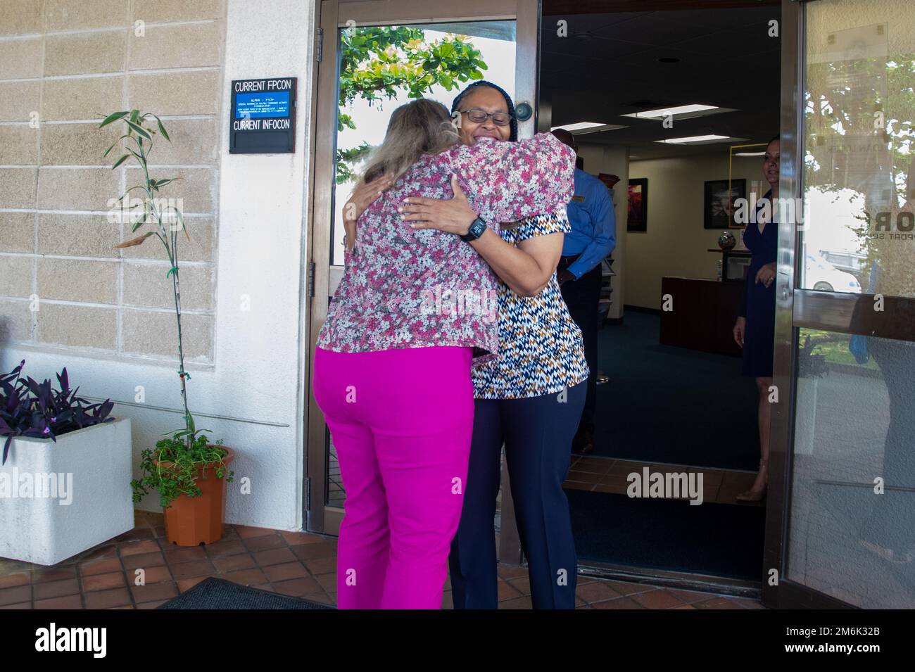 Charlotte Rupp hugs a representative from the Airman and Family ...