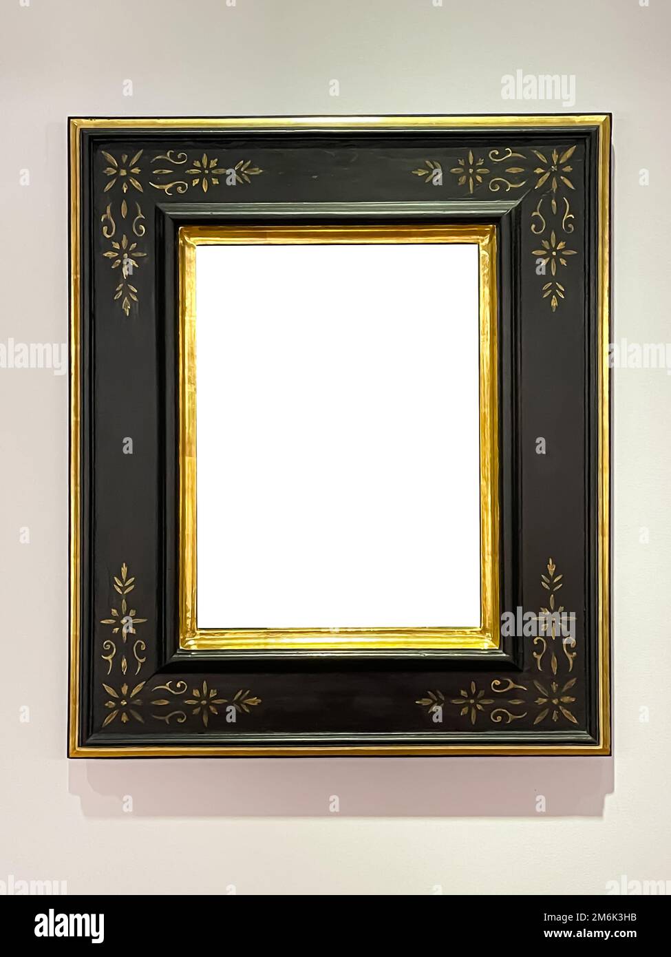 Antique wooden art fair gallery frame on the wall at auction house or ...