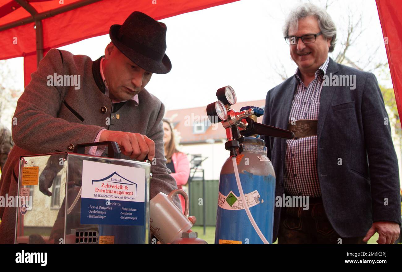 41st Field Artillery Brigade Commander Col. Daniel Miller pours a beer ...