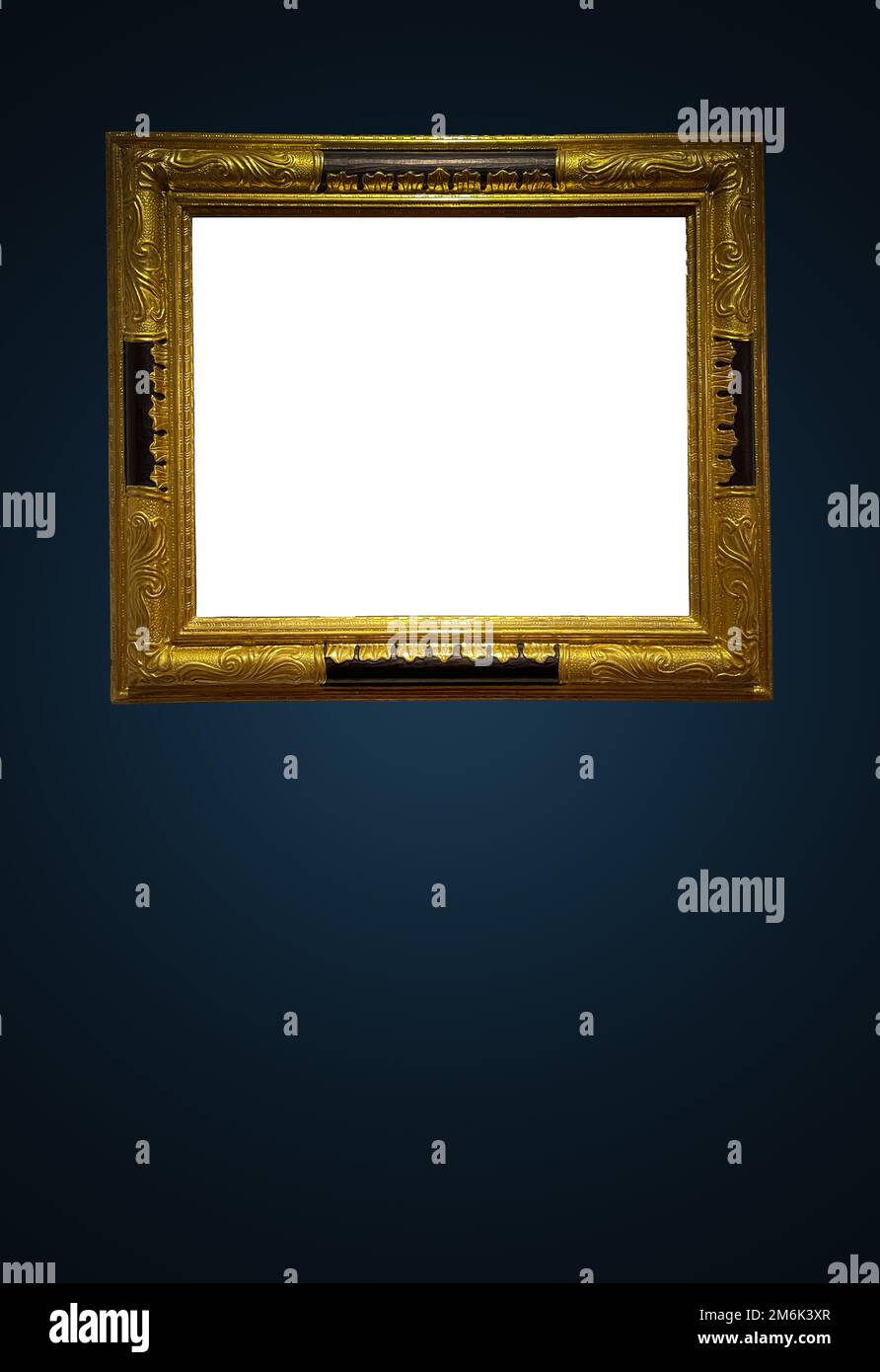 Antique art fair gallery frame on royal blue wall at auction house or ...