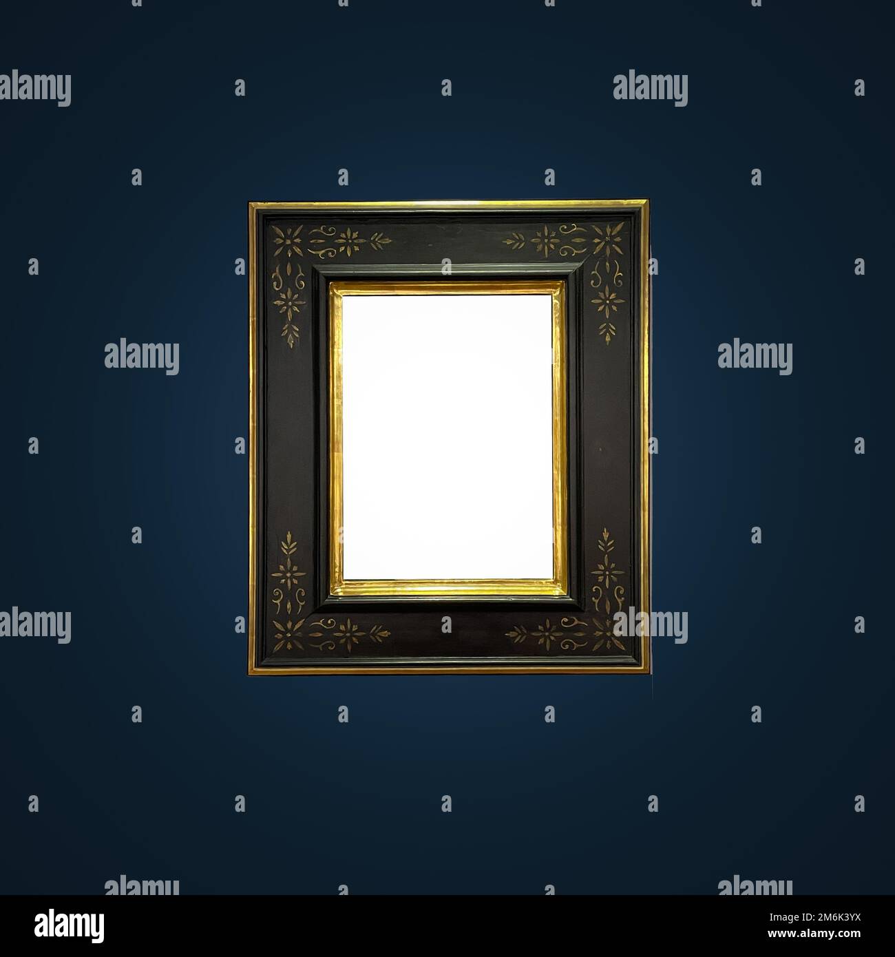 Antique art fair gallery frame on royal blue wall at auction house or ...