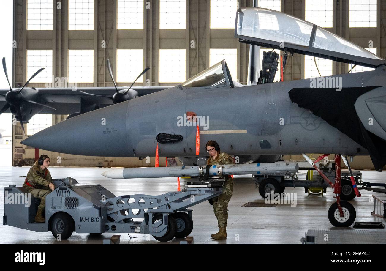 A 96th Aircraft Maintenance Squadron Red team moves an AIM-120 toward ...