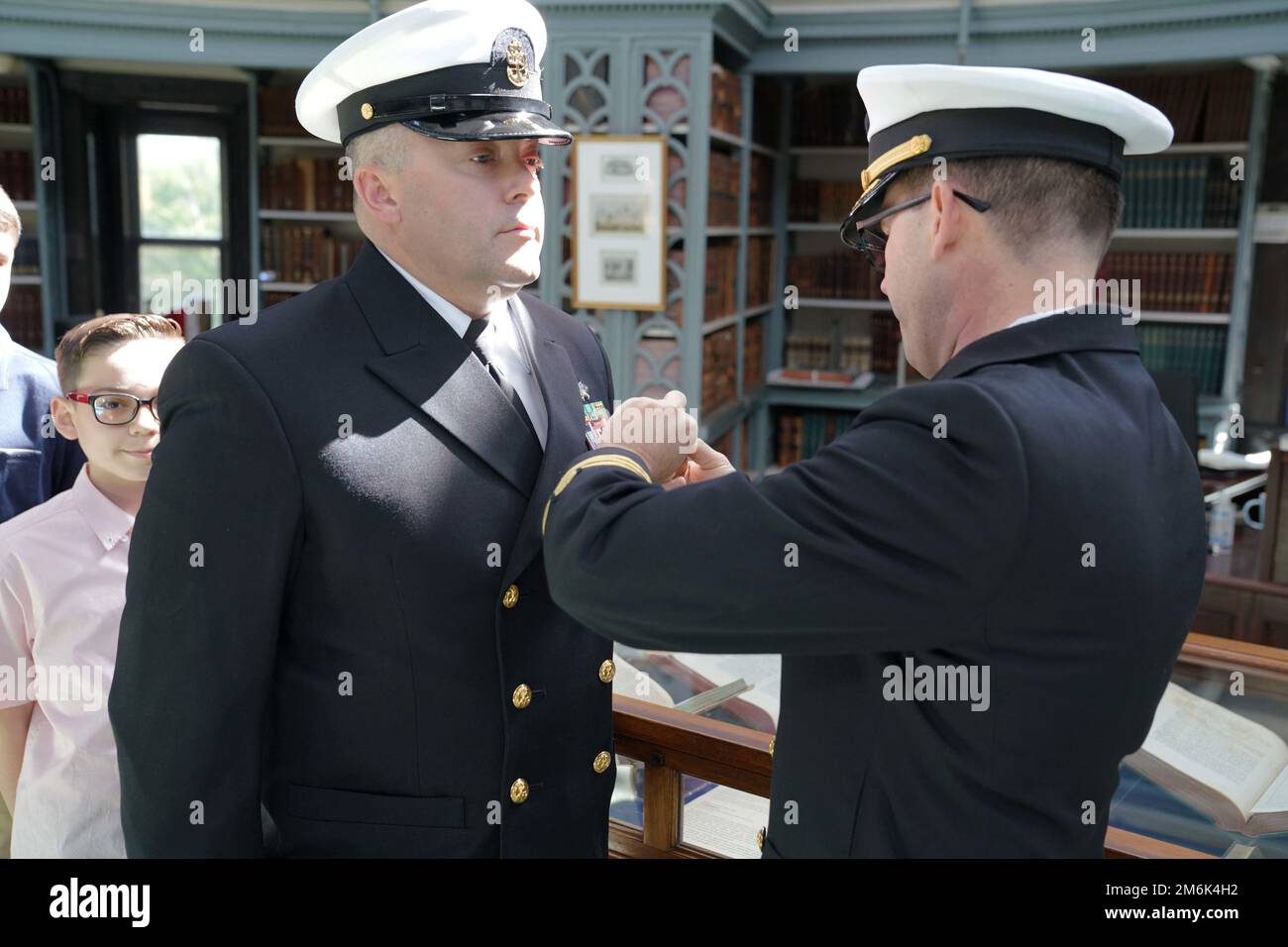 Seabee Chief Michael Baxter (left) has the Naval Commendation Medal ...